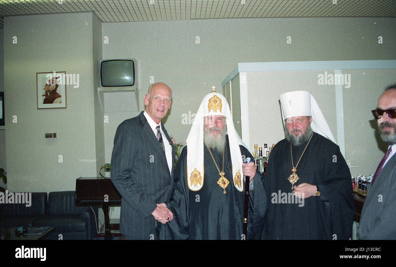 Four men greeting other hi-res stock photography and images - Alamy