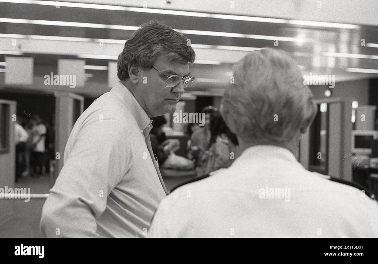 2 men talking Stock Photo - Alamy