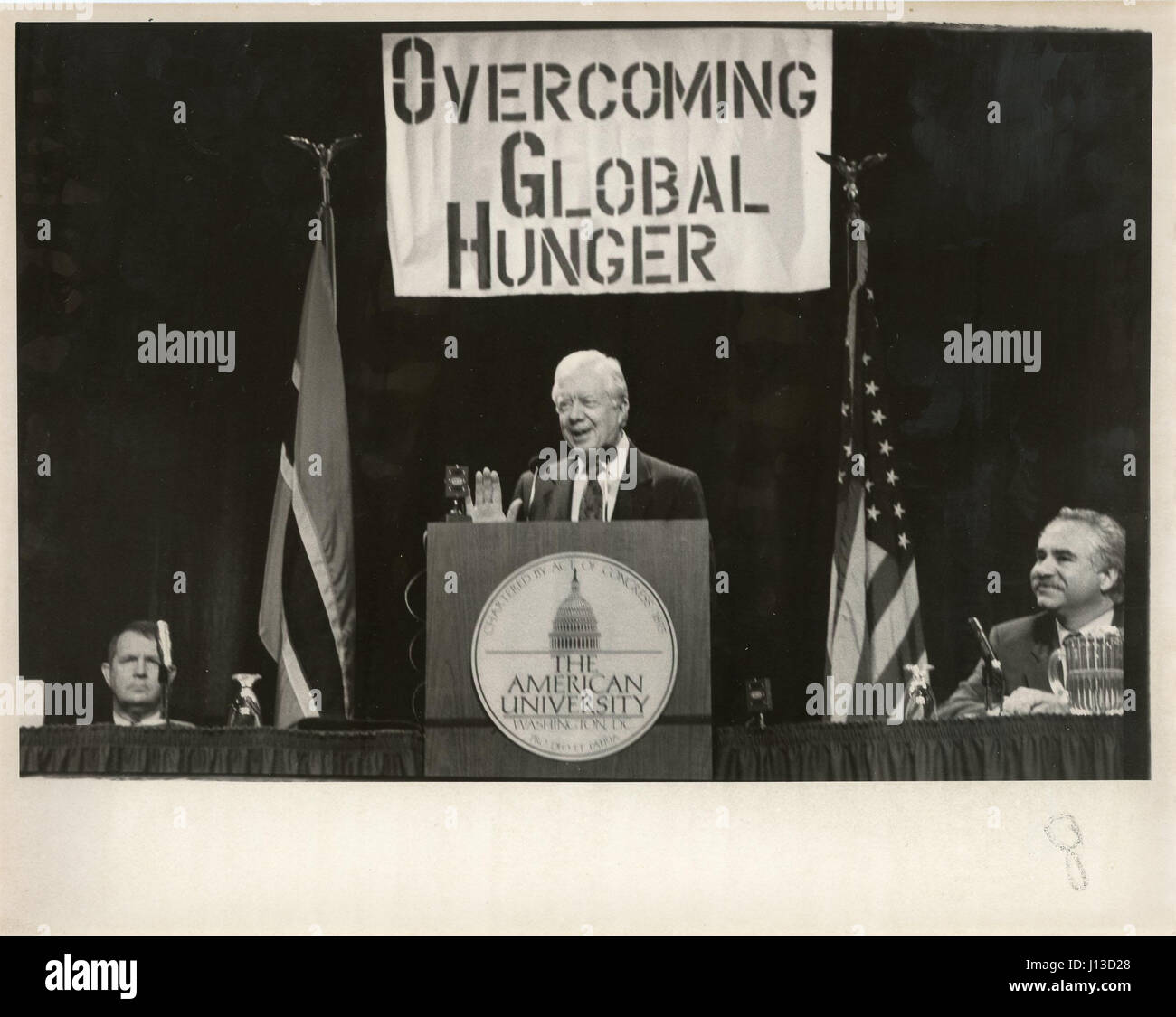 Military personnel deliver a briefing or presentation at a podium to ...