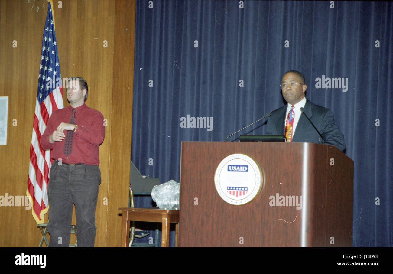 man accepting award speaking at podium Stock Photo - Alamy