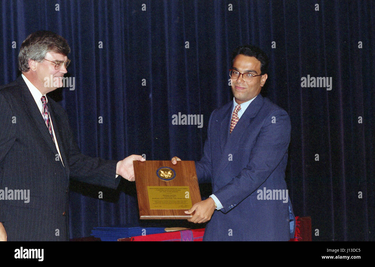 An award is presented at a CFC health fair, recognizing achievements ...