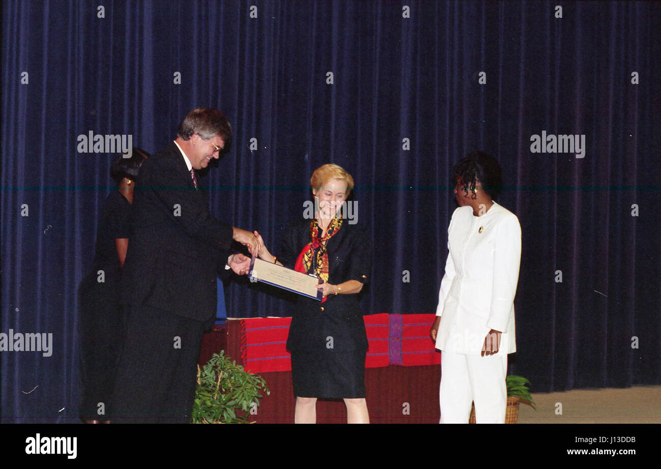 A woman receives an award on stage during a Combined Federal Campaign ...