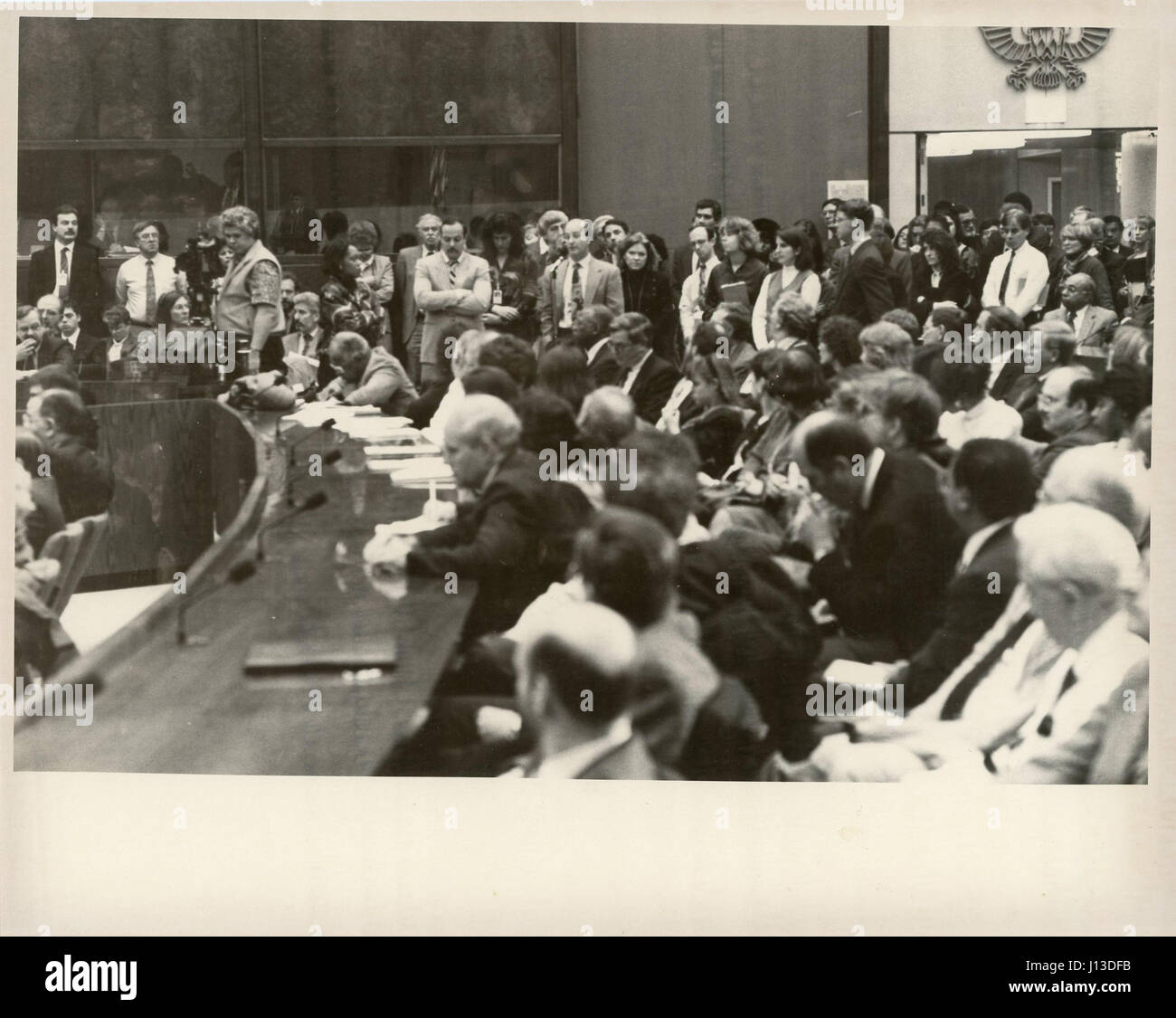 Employees gather in a conference room to discuss work matters, share ...