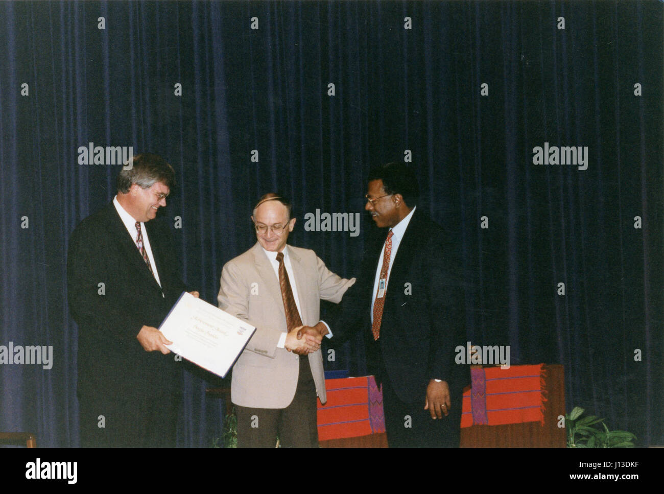 An award is presented during a formal honors ceremony, recognizing ...