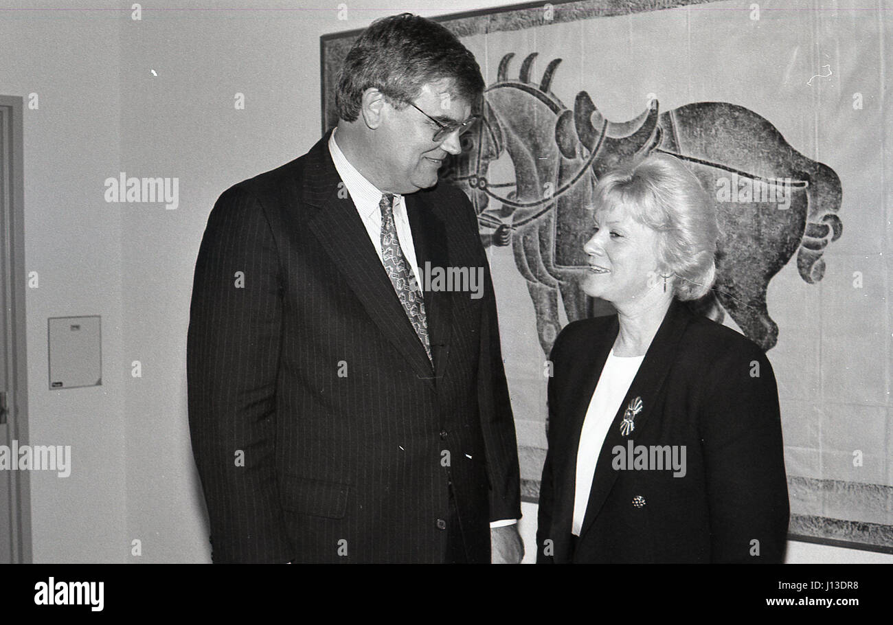 Two people engage in conversation, illustrating communication ...