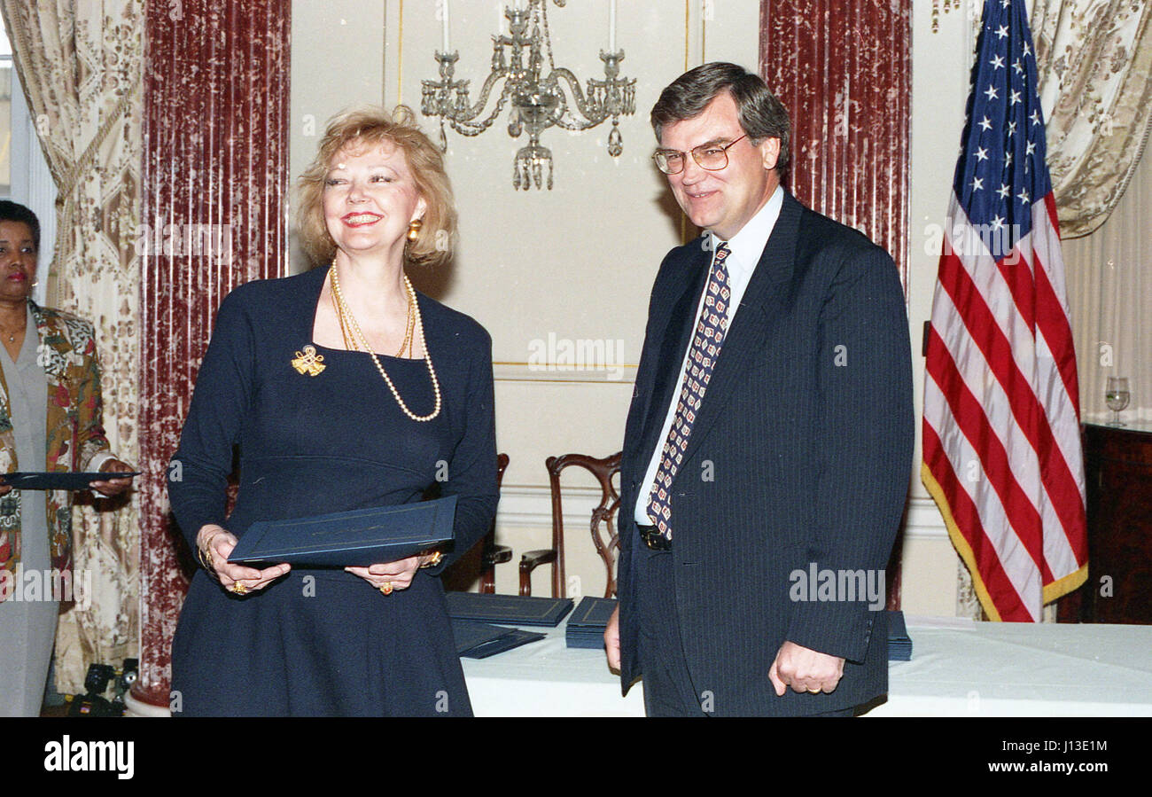 woman accepting award taking a picture Stock Photo - Alamy