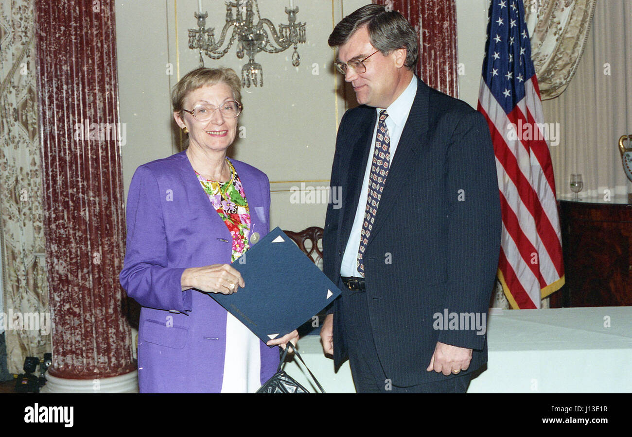 woman accepting award taking a picture Stock Photo - Alamy