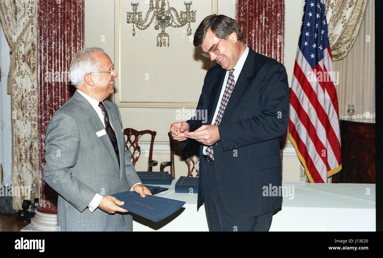 man accepting award taking a picture Stock Photo - Alamy