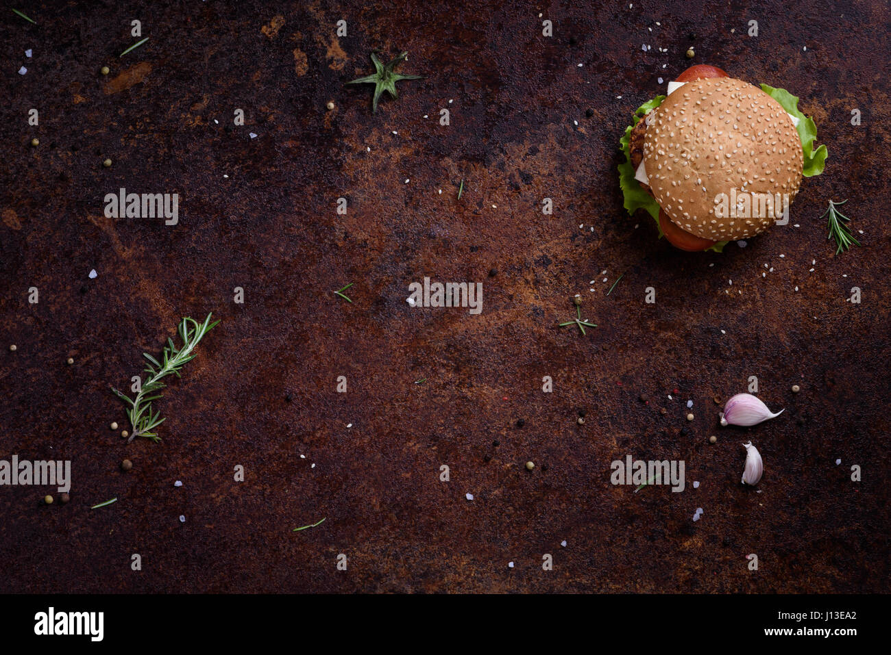 Delicious fresh homemade burger on a rustic table. Menu frame. View ...