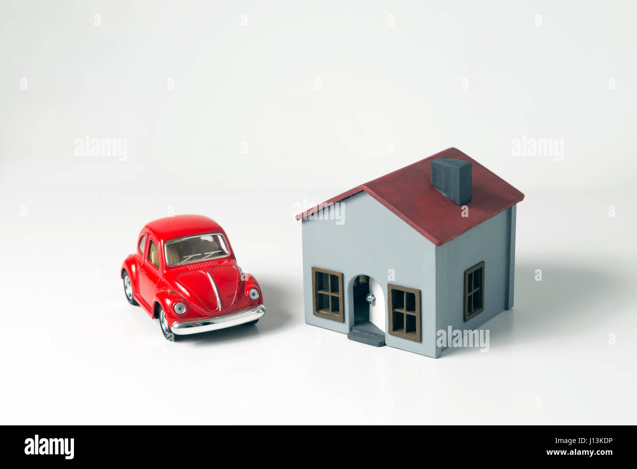 Izmir, Turkey - April 1, 2017: Red toy car and miniature house on a ...