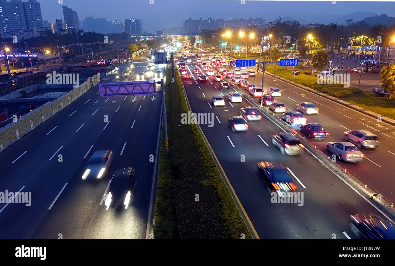 Dense traffic at evening rush hour on a main street in Kaohsiung ...