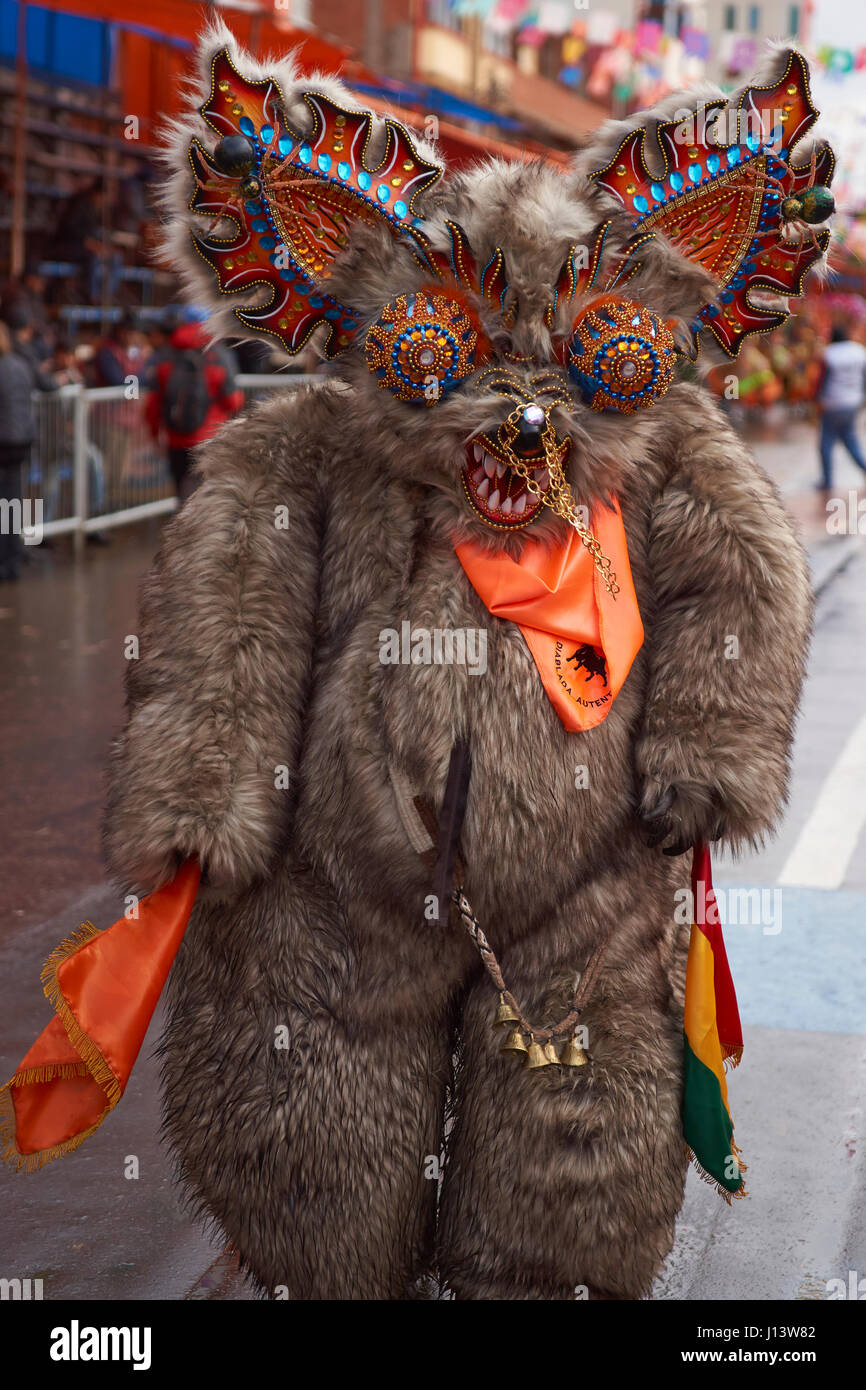Diablada dancer in ornate bear costume parading through the mining city ...