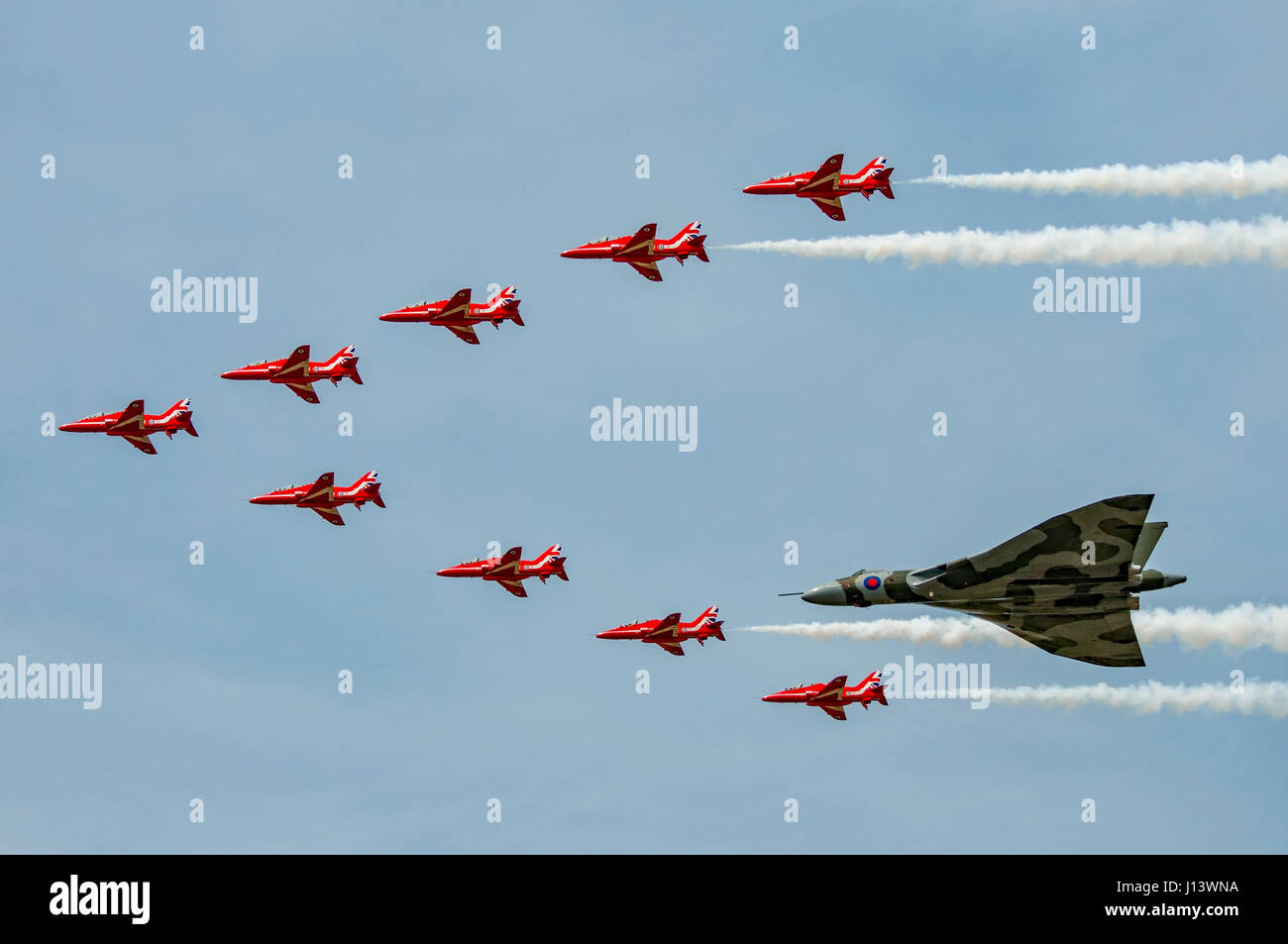 The RAF Red Arrows in formation with the Avro Vulcan B.2 bomber (XH558 ...