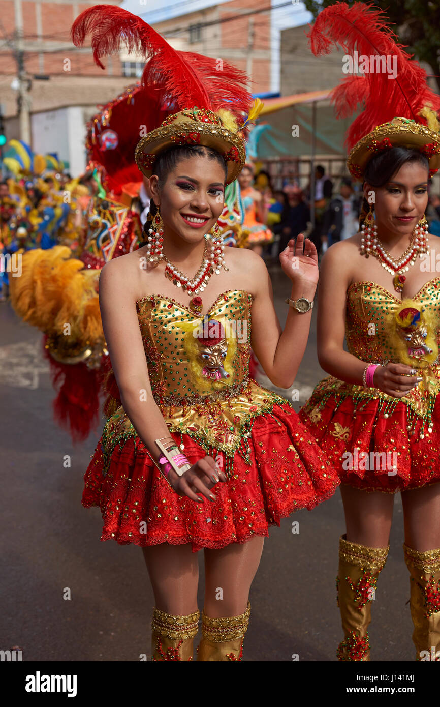 Female Morenada dancers in colourful costumes parading through the ...