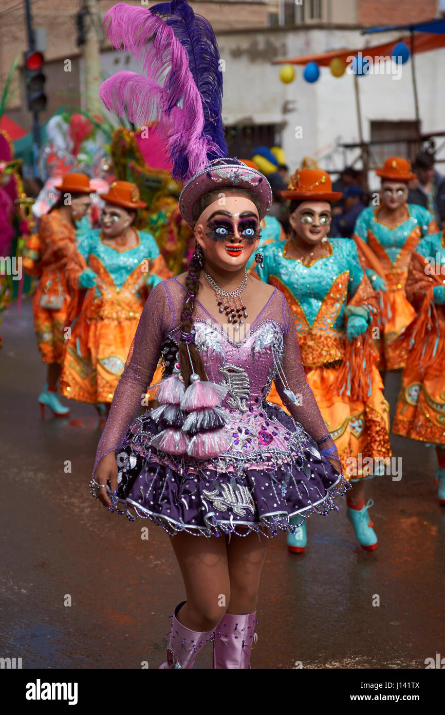 Female Morenada dancers in colourful costumes parading through the ...