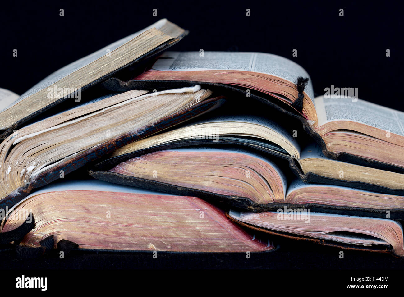 Stack of open bibles and prayer books Stock Photo - Alamy