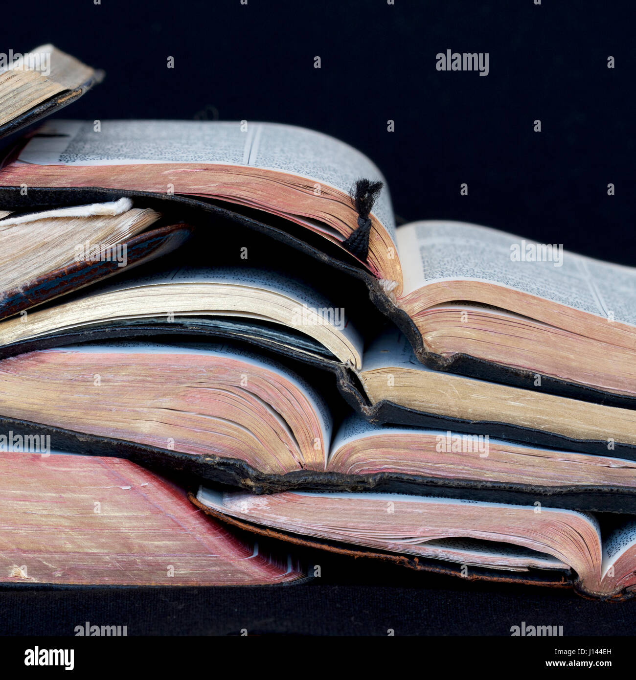 Stack of open bibles and prayer books Stock Photo - Alamy