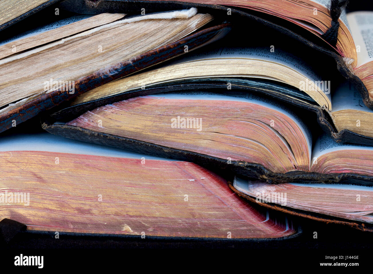 Stack of open bibles and prayer books Stock Photo - Alamy