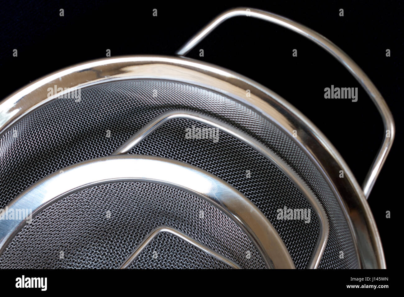 Stainless steel kitchen sieve Stock Photo - Alamy