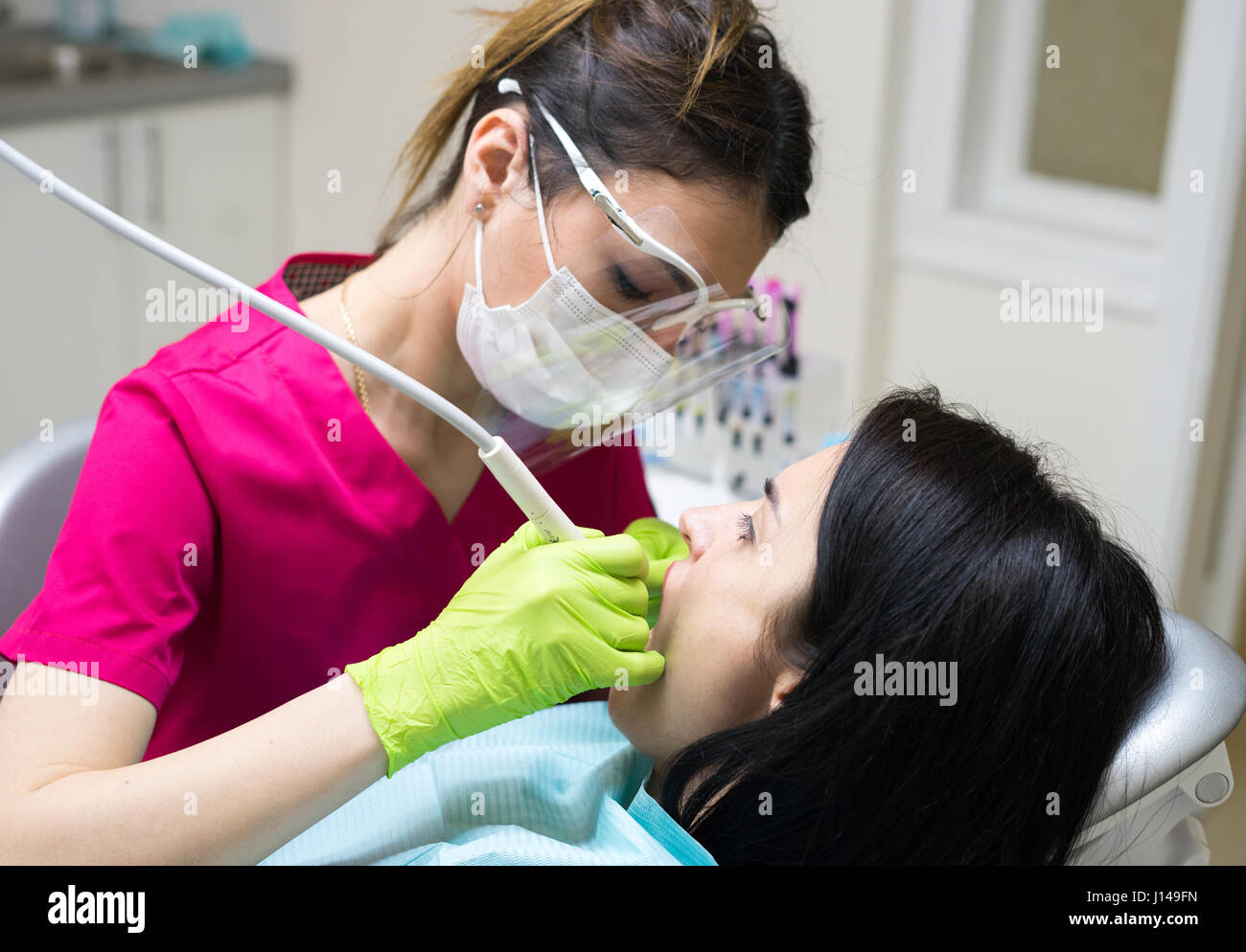 Dental hygienist teeth cleaning close hi-res stock photography and ...
