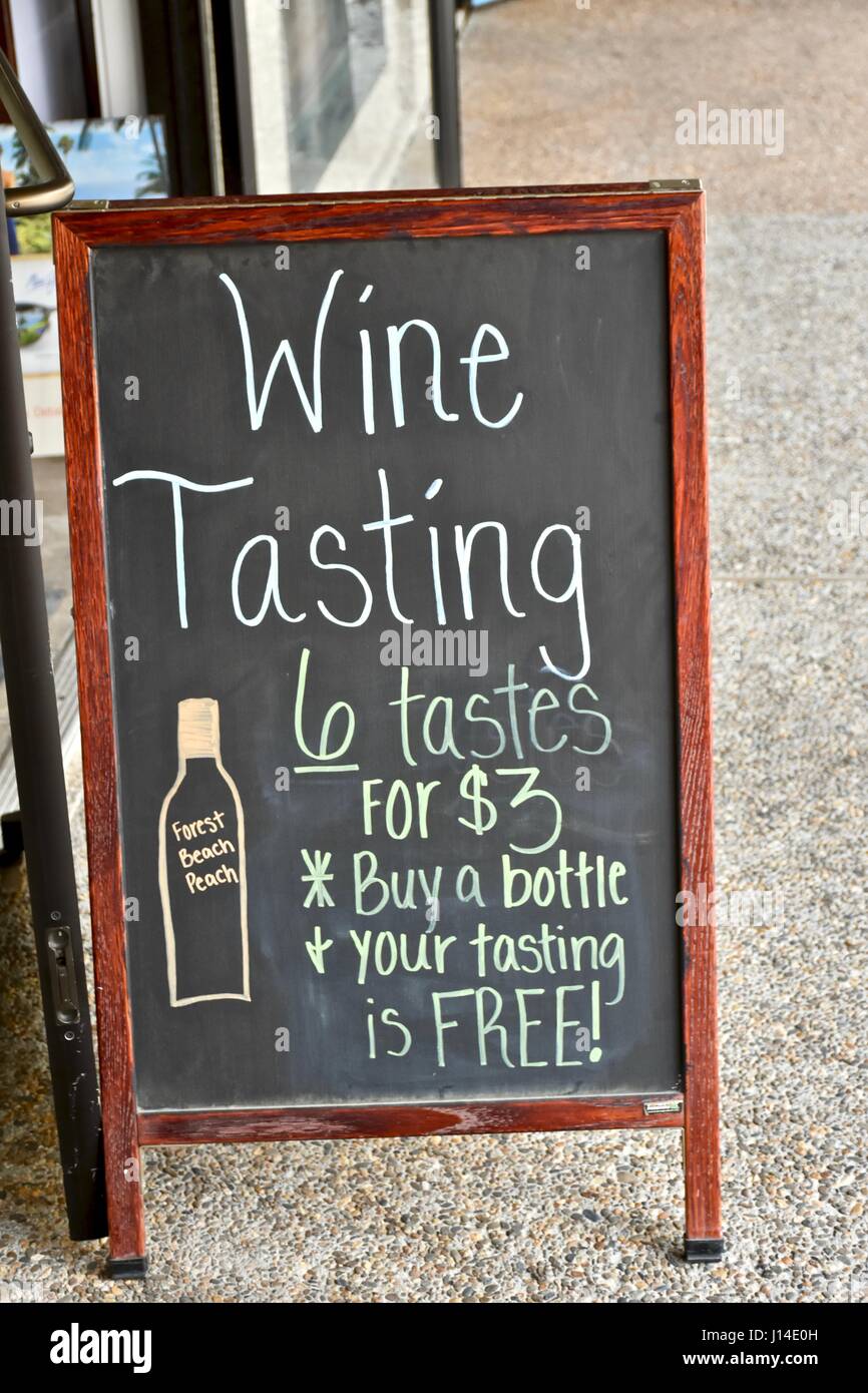 Free wine tasting with bottle purchase sign, USA Stock Photo - Alamy