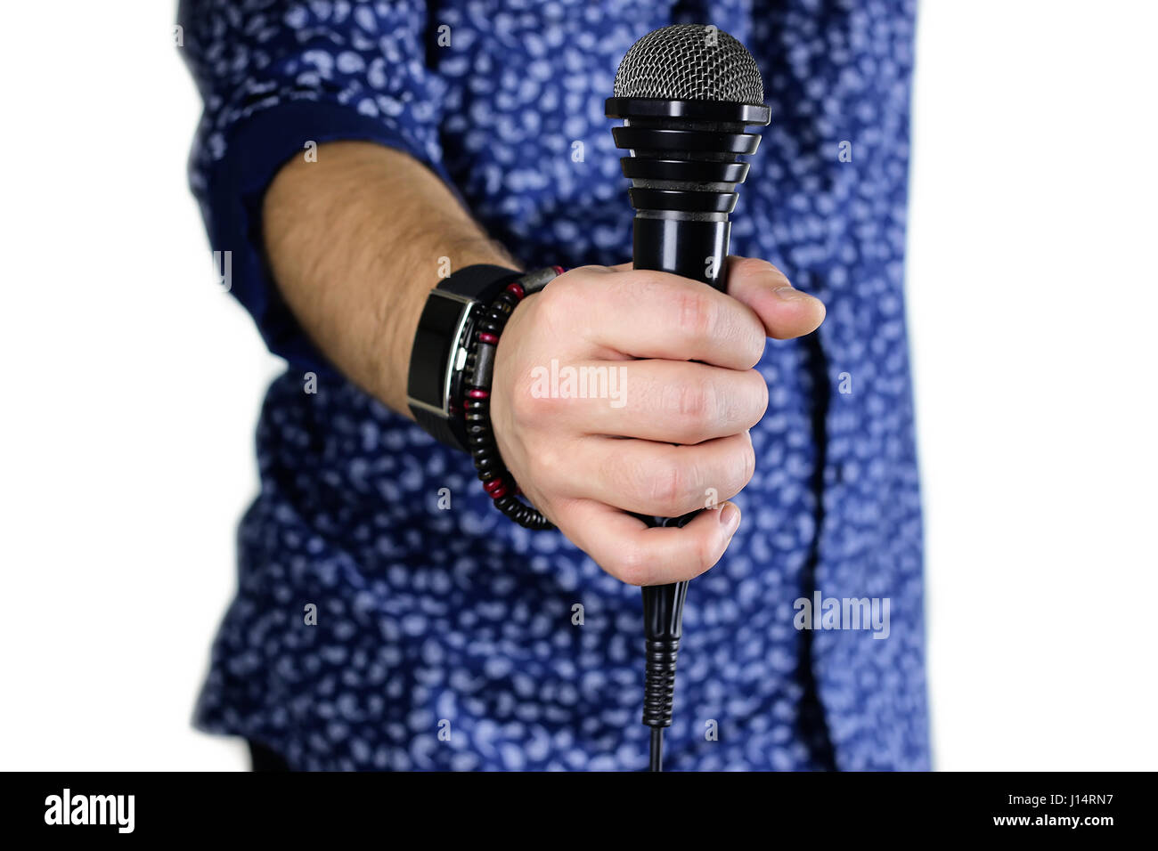 microphone on stage hand hold Stock Photo - Alamy