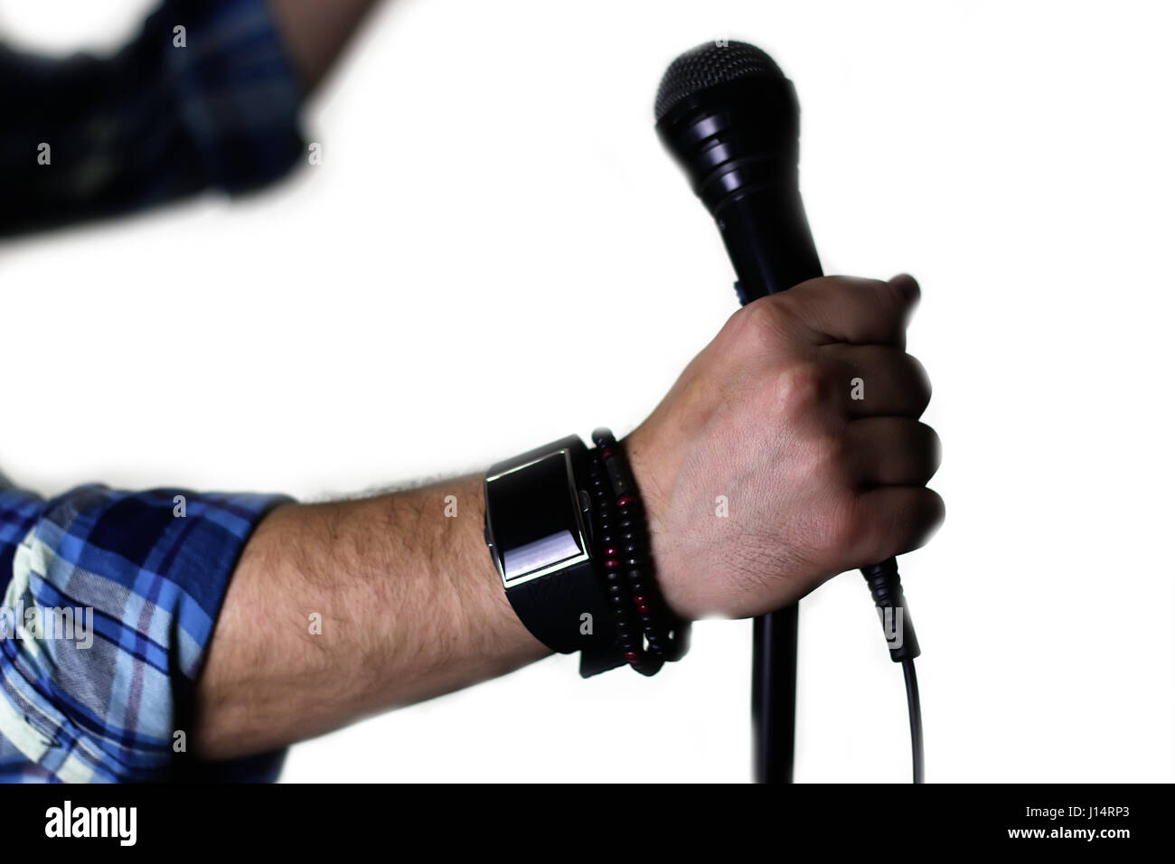 microphone on stage hand hold Stock Photo - Alamy