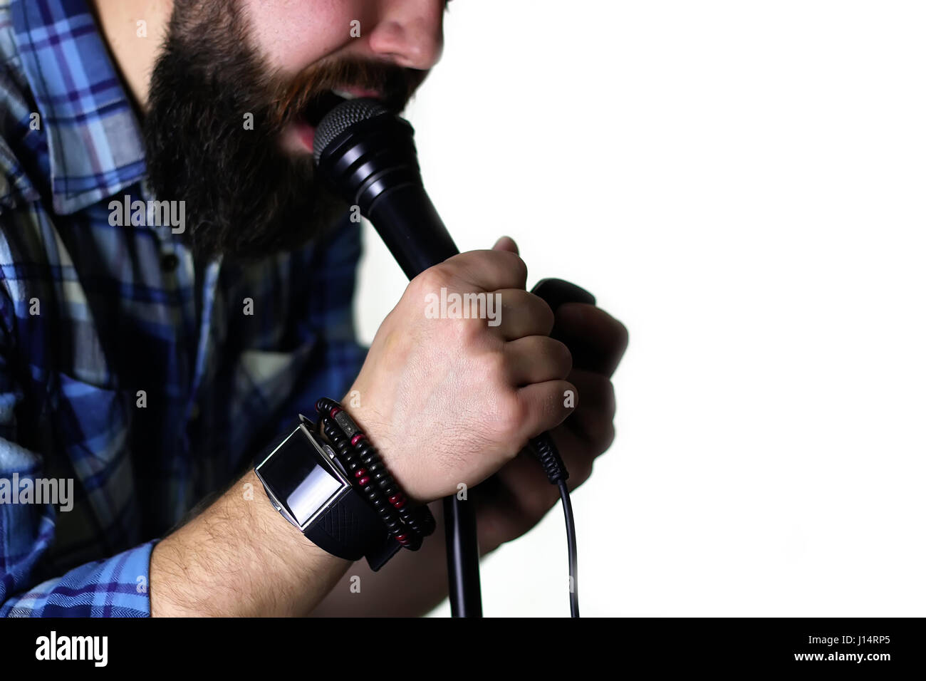 microphone on stage hand hold Stock Photo - Alamy