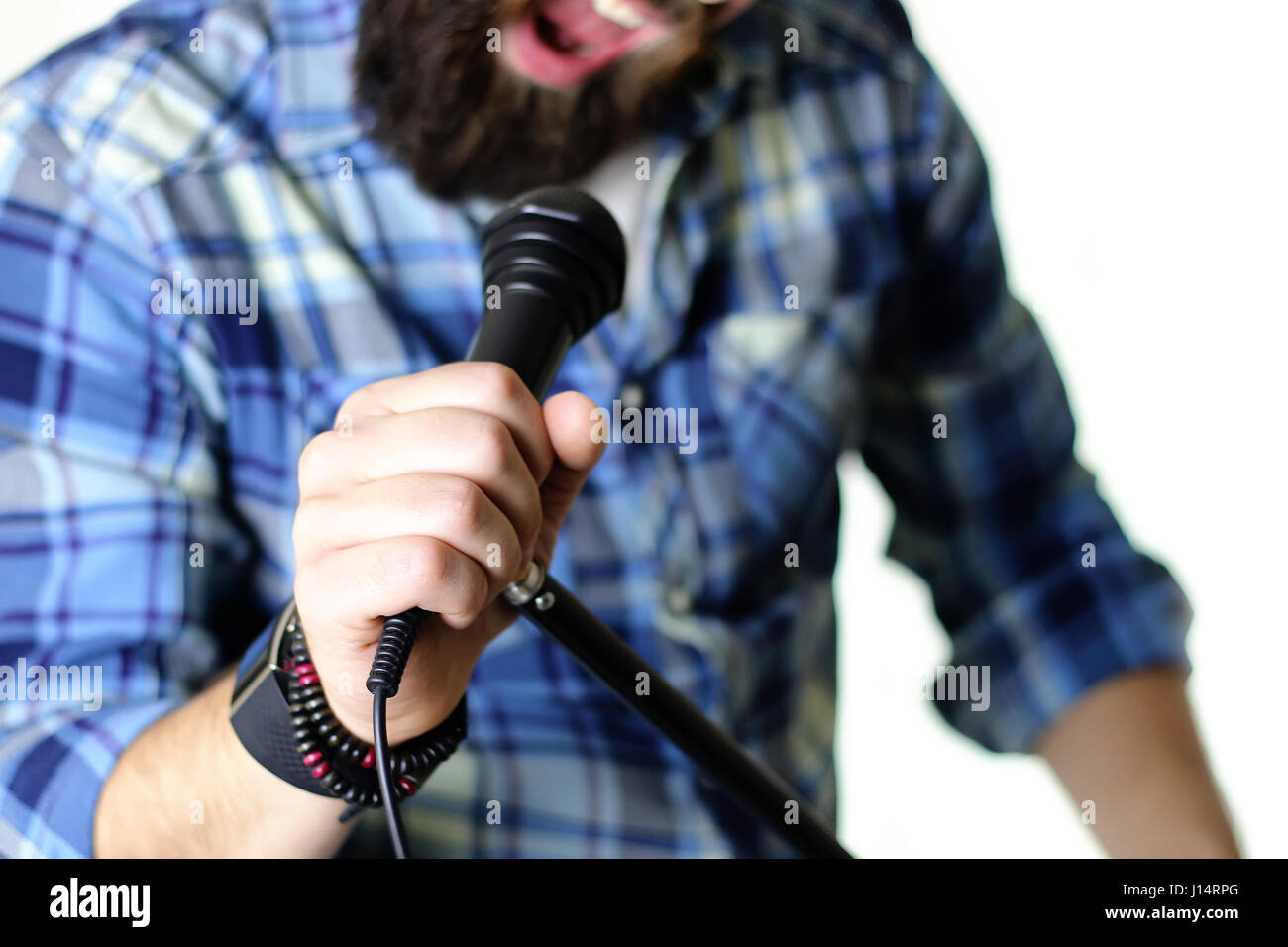 microphone on stage hand hold Stock Photo - Alamy