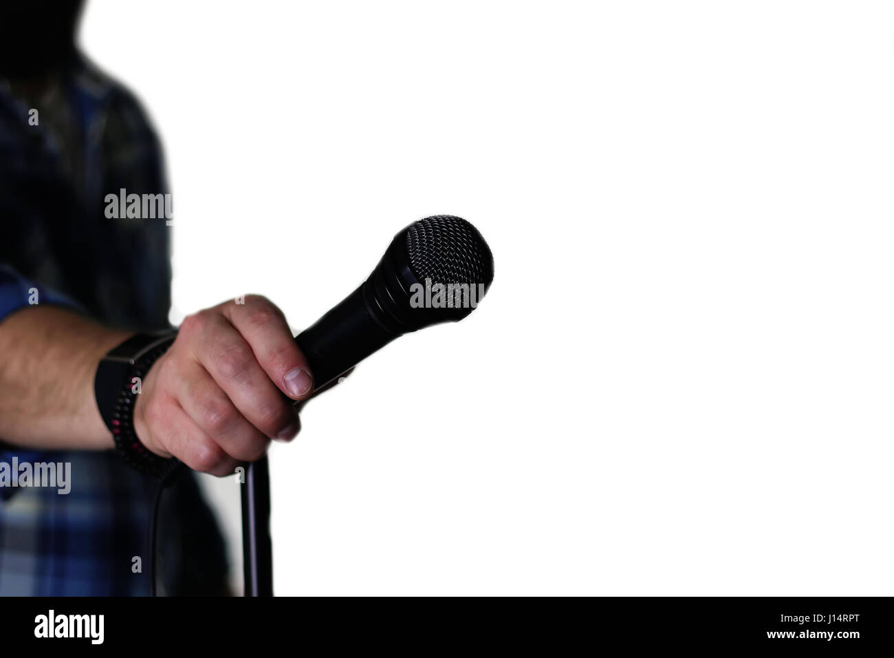 microphone on stage hand hold Stock Photo - Alamy
