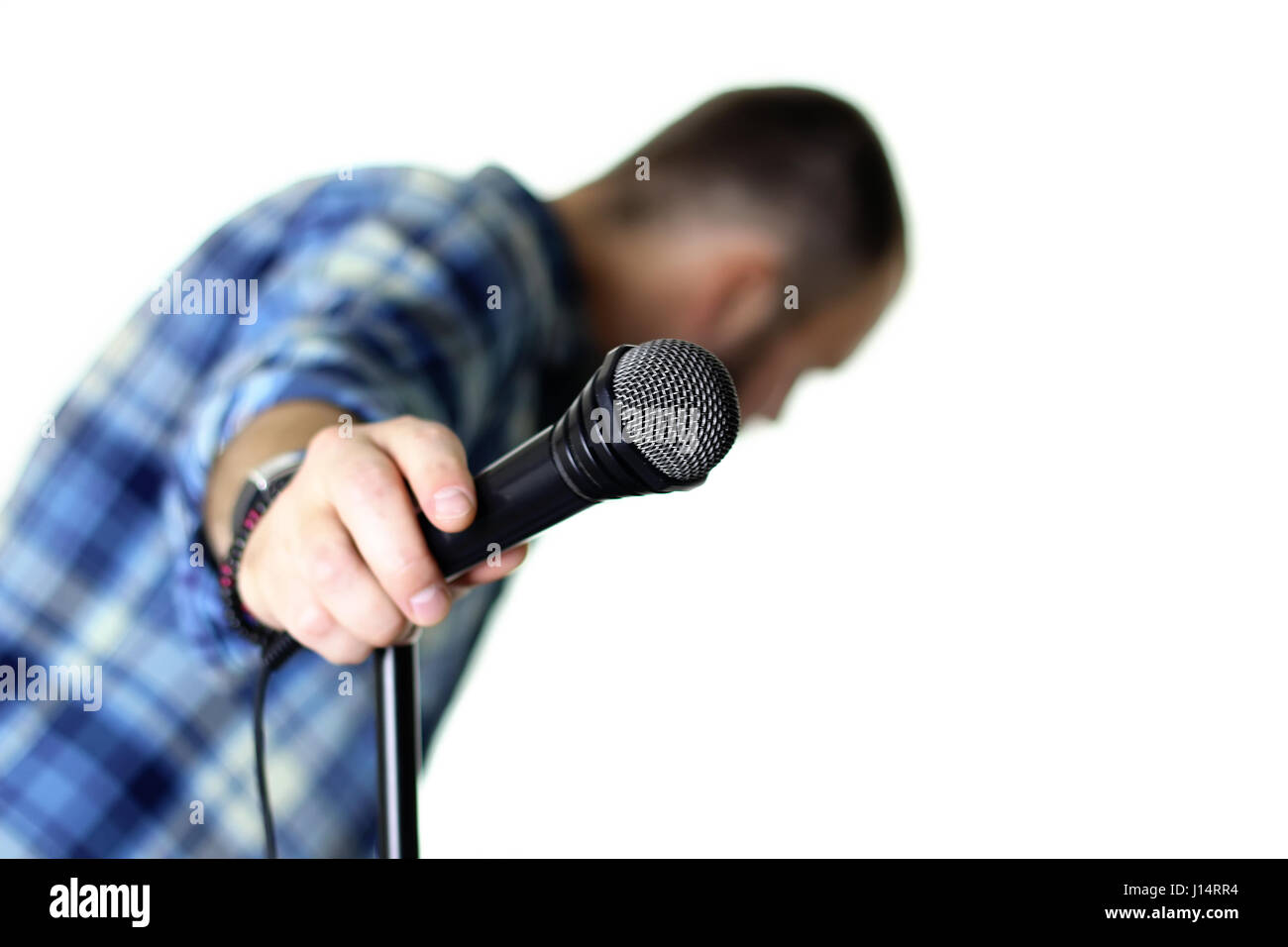 microphone on stage hand hold Stock Photo - Alamy