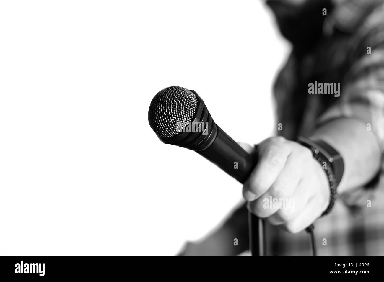 Hand holding the mic Black and White Stock Photos & Images - Alamy
