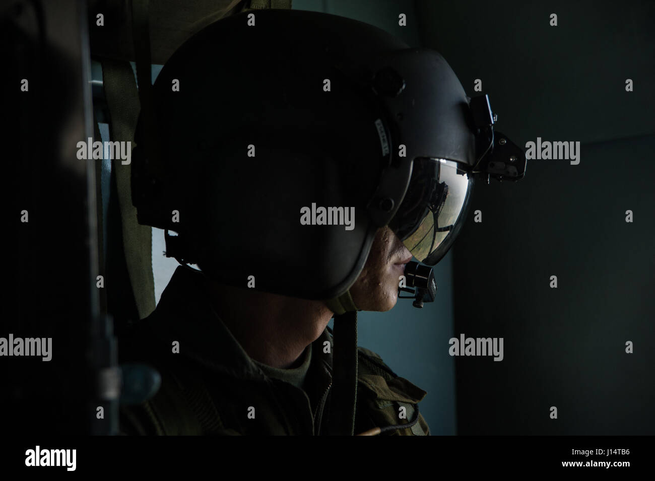 A door gunner on a Colombian military helicopter, Cartagena, Colombia ...