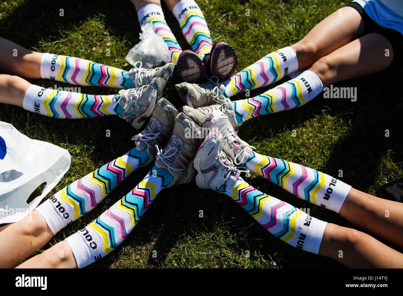 Color Run participants wear official Color Run outfit: knee stockings ...