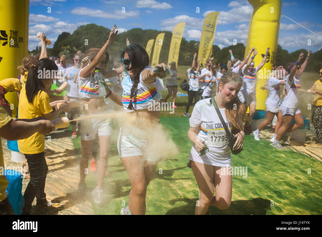 The many color runners have fun and are here passing the yellow color ...