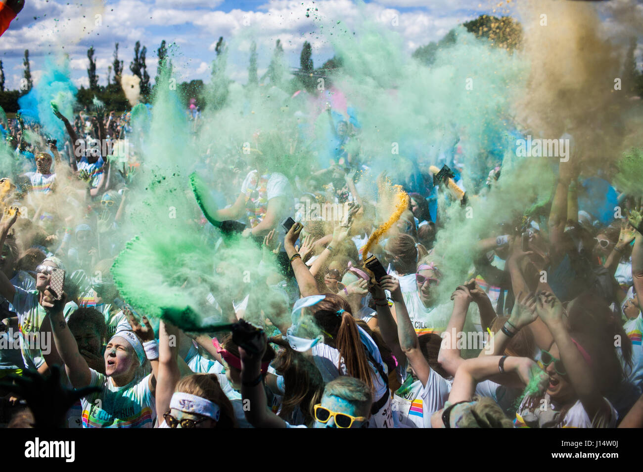 The air is thick of color powder at The Color Run in Copenhagen. Around ...