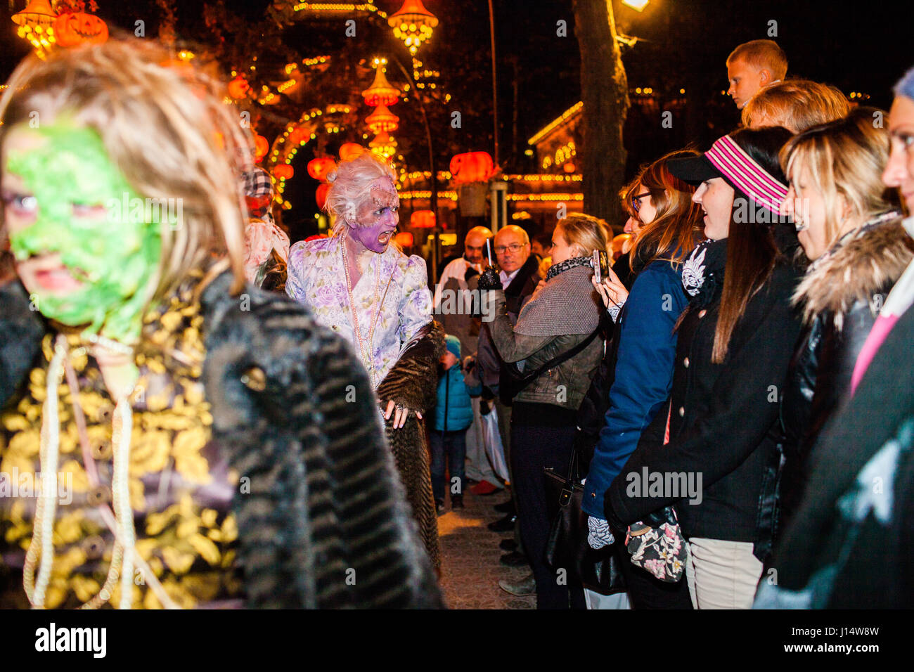 A zombie screams at the guests at the monster parade in the old ...