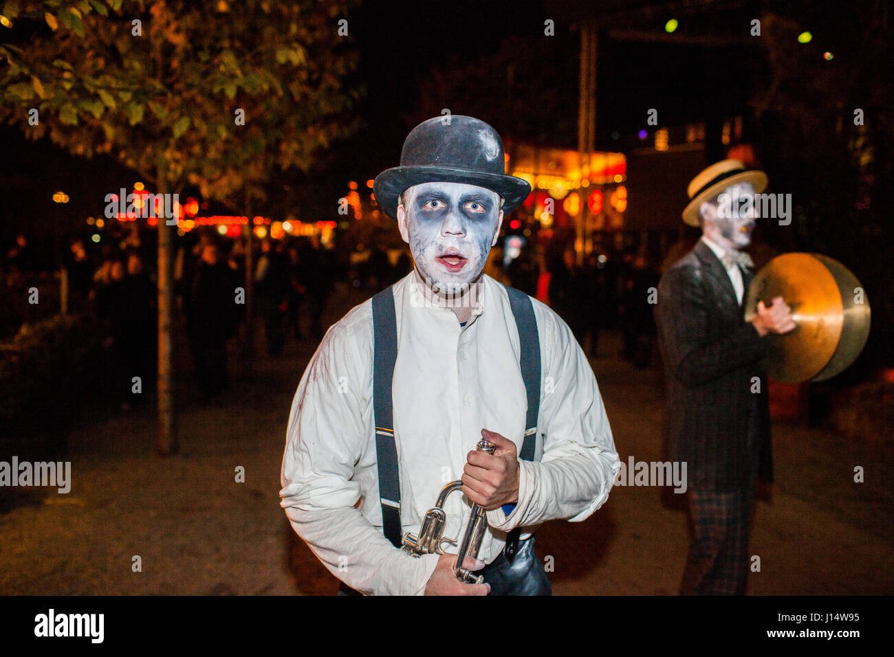 A surprised looking ghost trumpet player forms part of a marching band ...