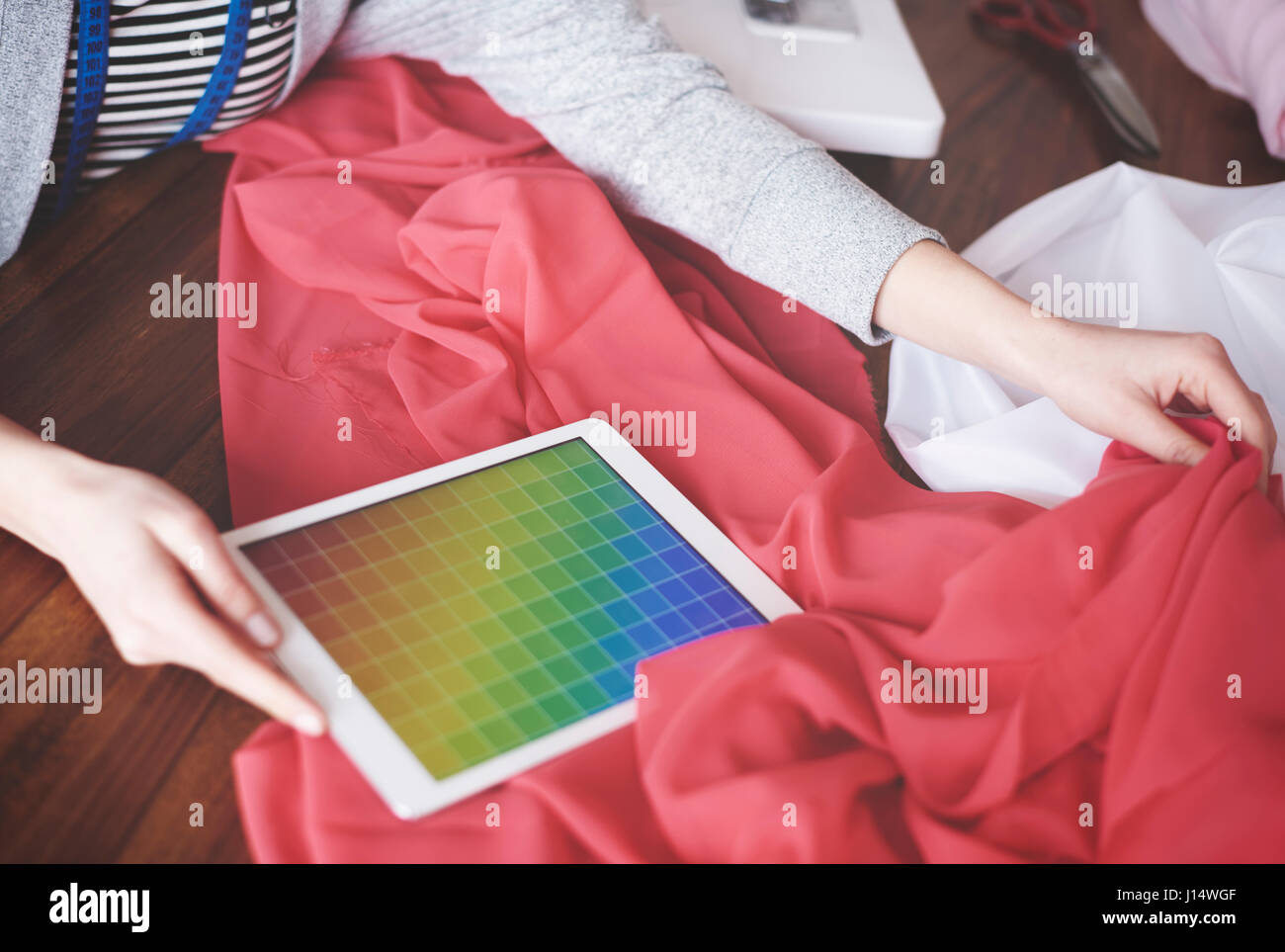 Fashion designer matching colors with textile Stock Photo - Alamy