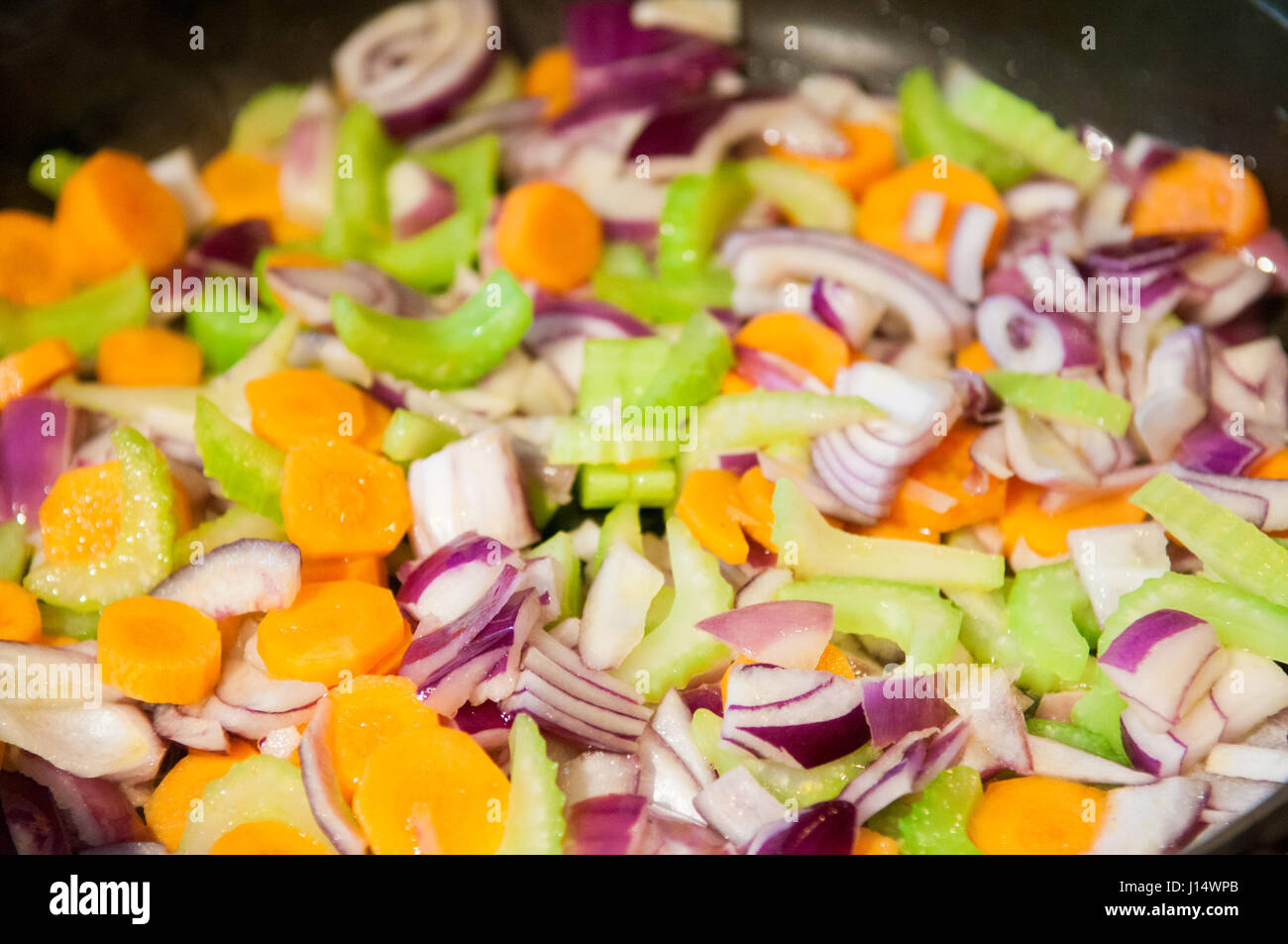 Fresh food ingredients cooking in the pan Stock Photo - Alamy