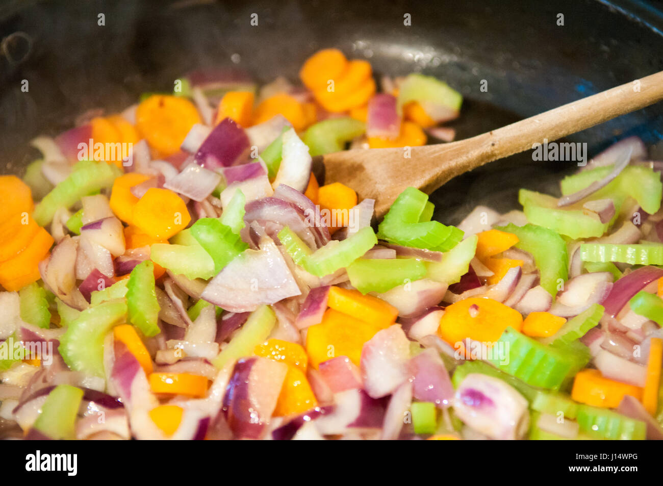 Fresh food ingredients cooking in the pan Stock Photo - Alamy