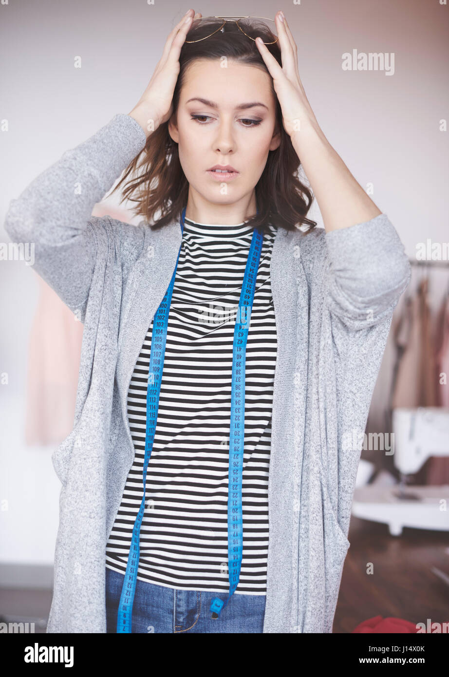 Confident clothing designer in her showroom Stock Photo - Alamy