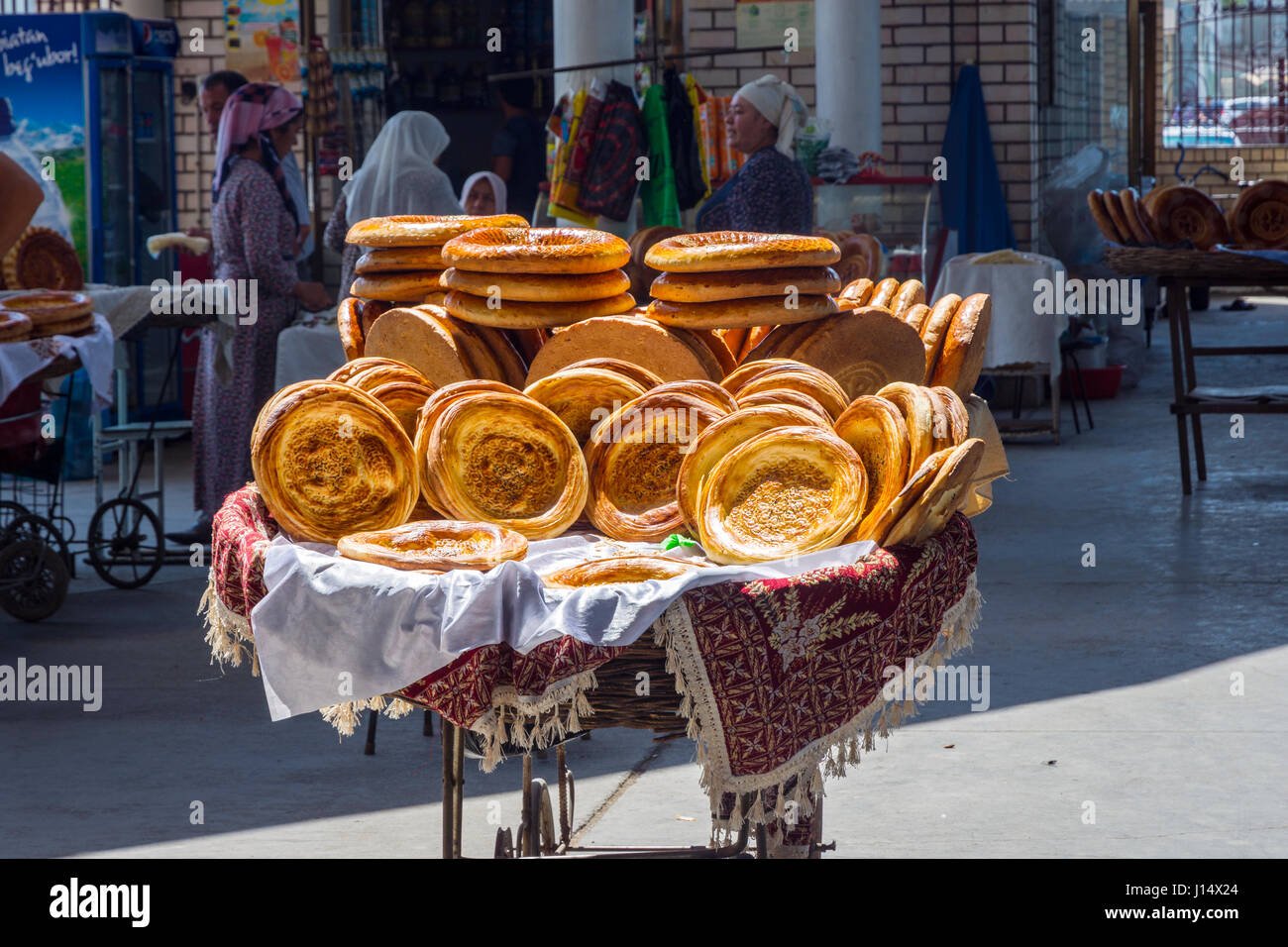 Traditional Uzbek bread called non or lepeshka in the trolley at the ...