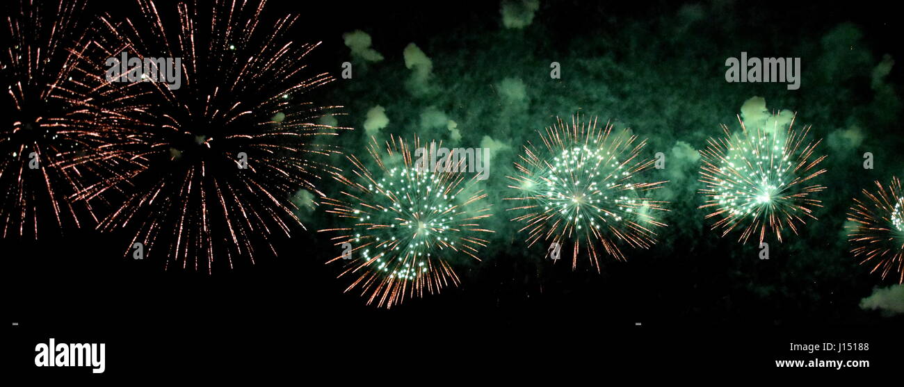 Festive fireworks in night sky. A single shot of the colorful fireworks ...