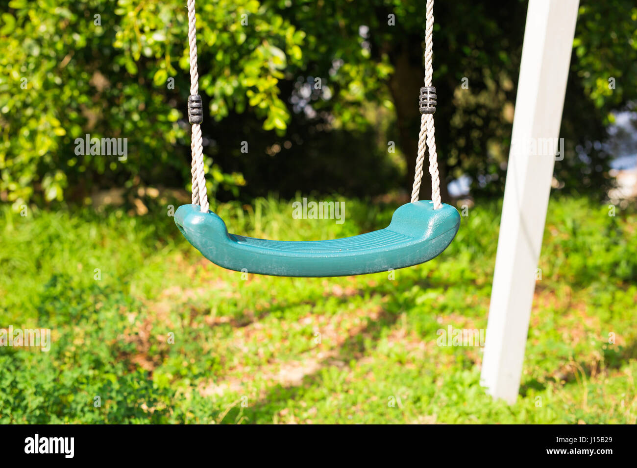 Children swing at Playground Stock Photo - Alamy