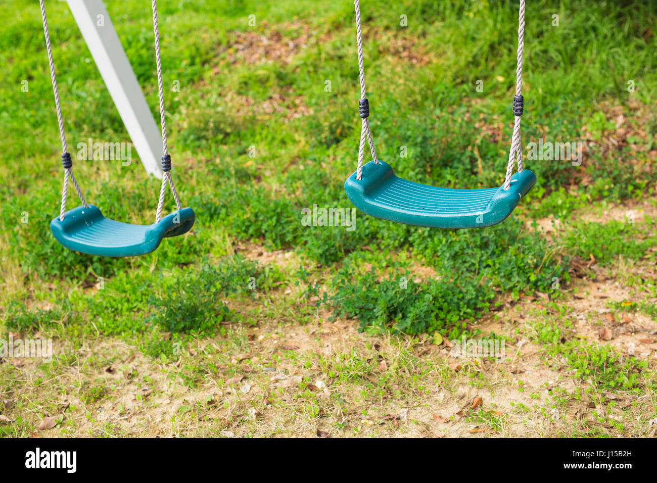 Children swing at Playground Stock Photo - Alamy