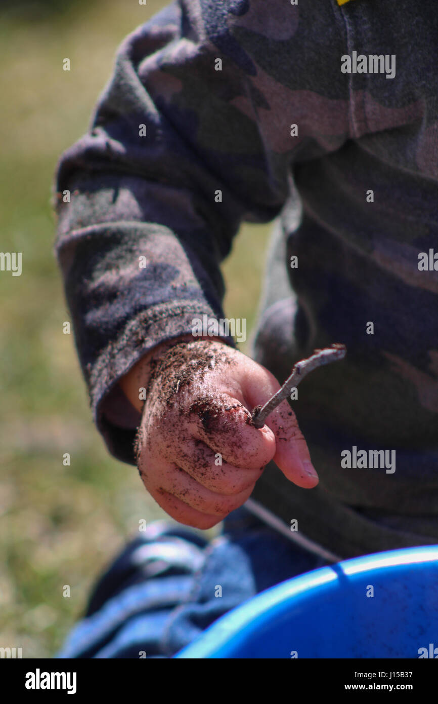 toddler playing with stick and dirt Stock Photo - Alamy