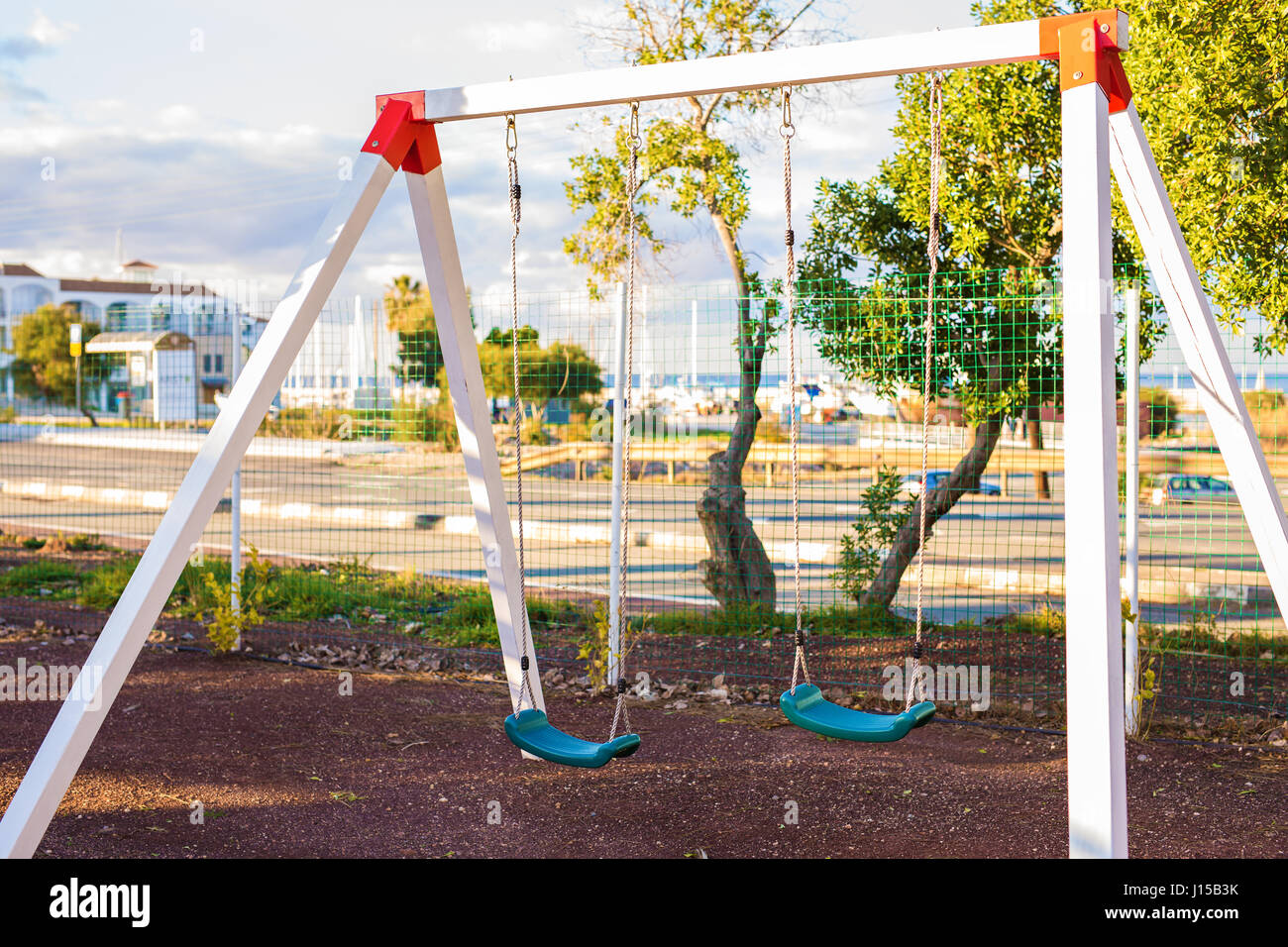 Children swing at Playground Stock Photo - Alamy