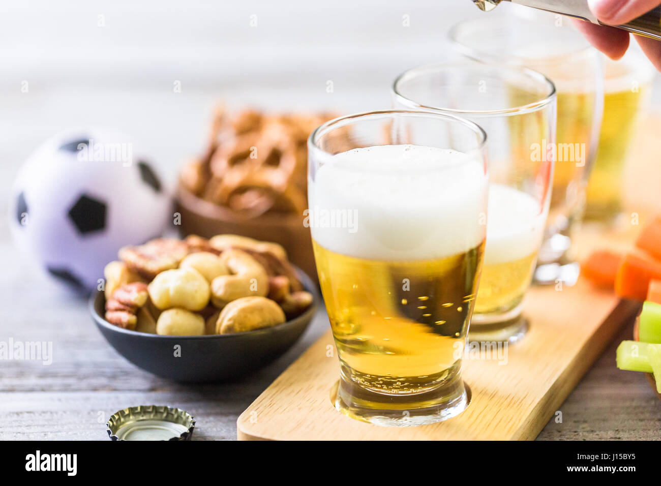 Step by step. Pouring draft beer into beer glass Stock Photo - Alamy