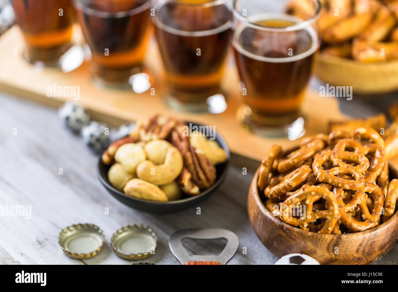 Draft beer and salty snacks on the table for soccer party Stock Photo ...